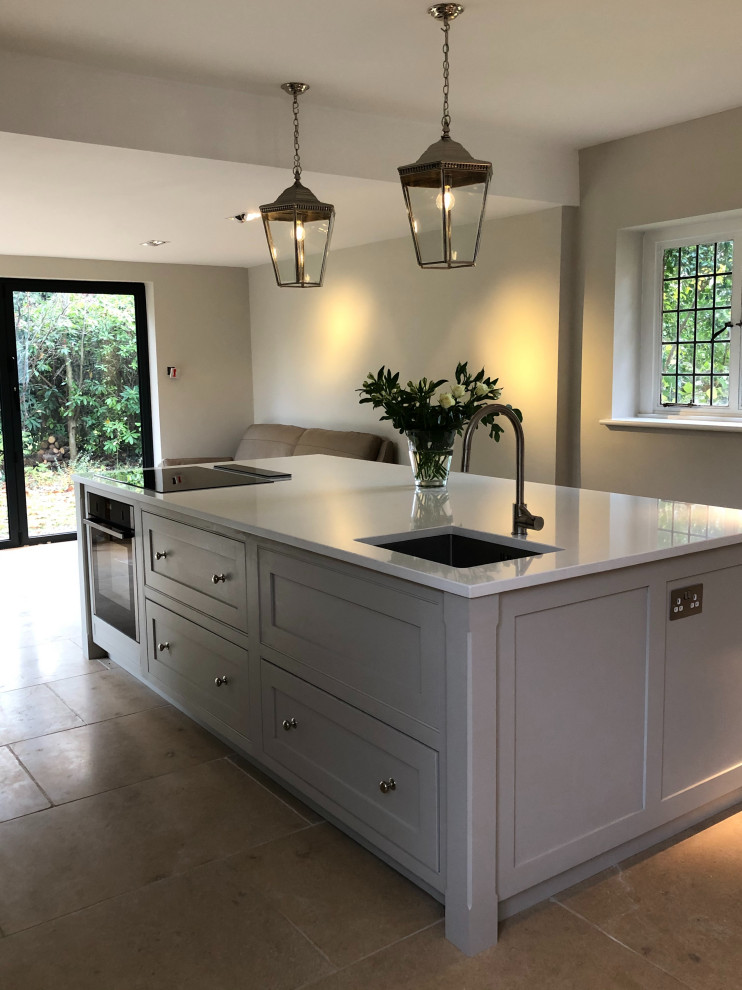 Grey handmade kitchen with beaded cabinets and large kitchen island ...