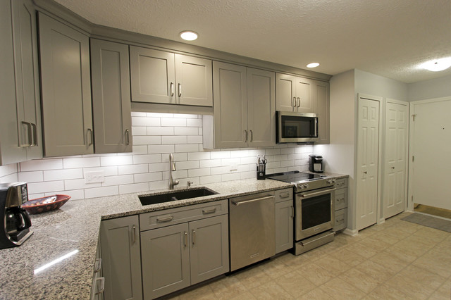 Grey Kitchen with White Subway Tile Backsplash and Granite Countertops ...