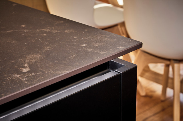 Handle-less Black kitchen with Copper accents & bespoke Concrete ...