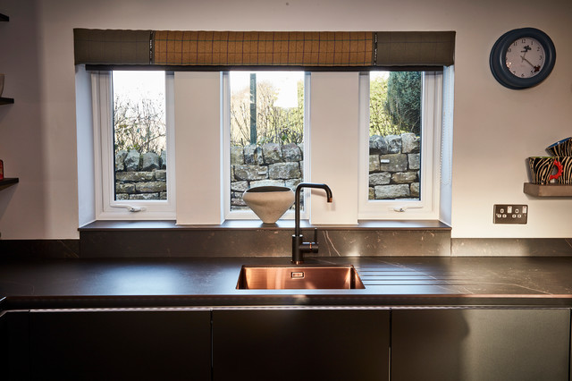 Handle-less Black kitchen with Copper accents & bespoke Concrete ...