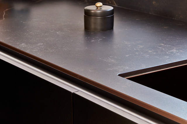 Handle-less Black kitchen with Copper accents & bespoke Concrete ...