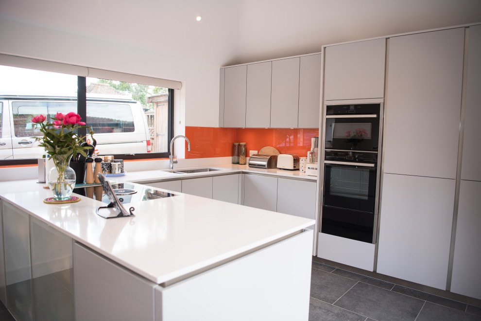 Handleless Grey Kitchen with Orange Splashback - Modern - Kitchen ...