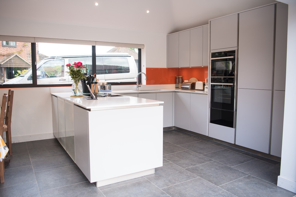 Handleless Grey Kitchen with Orange Splashback - Modern - Kitchen ...