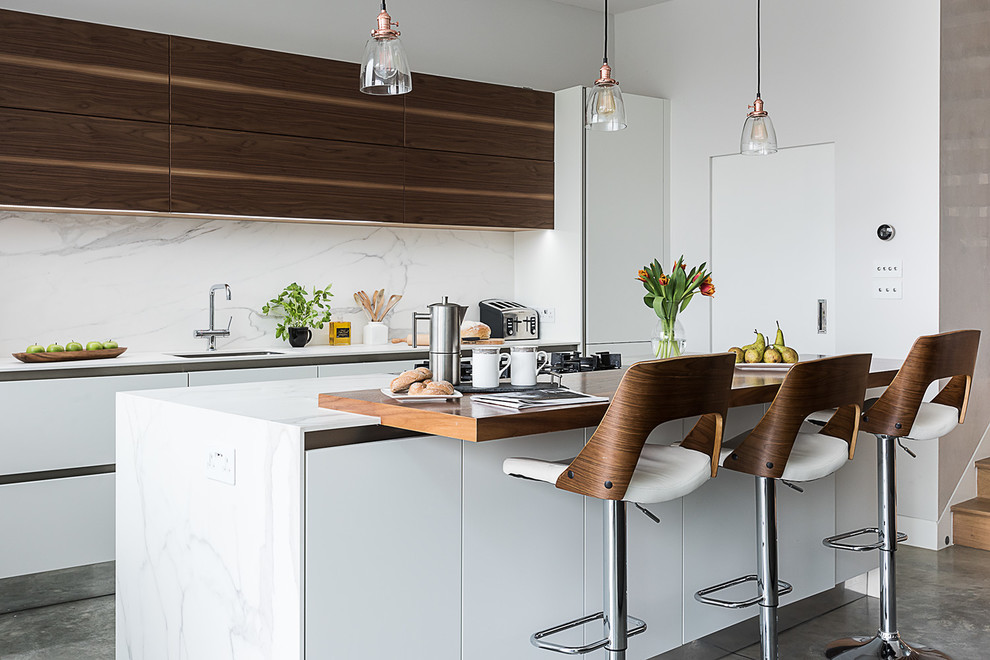 Handles kitchen in white matt finish with walnut veneer bookmatch wall ...