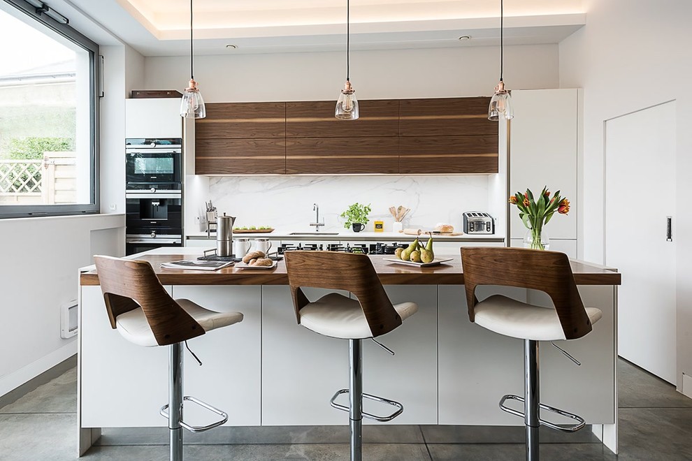 Handles kitchen in white matt finish with walnut veneer bookmatch wall ...