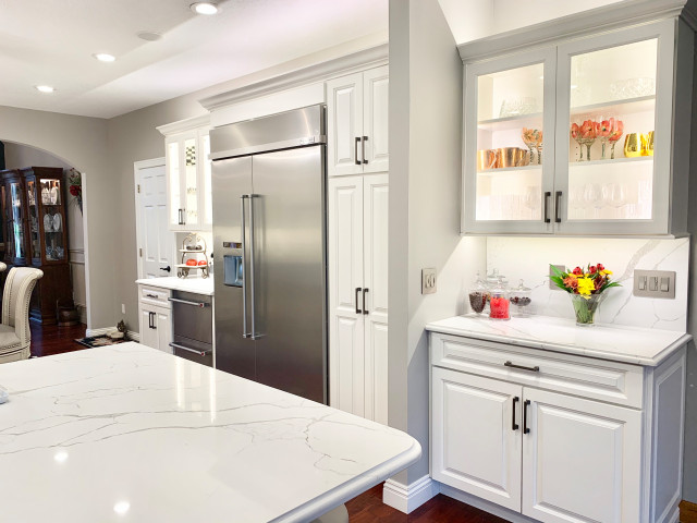 Ivory White Kitchen With Marble Look Quartz Counters and Splash ...
