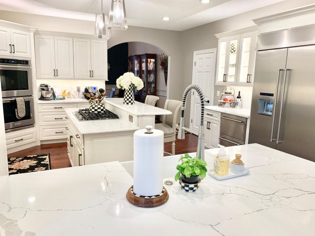 Ivory White Kitchen With Marble Look Quartz Counters and Splash ...