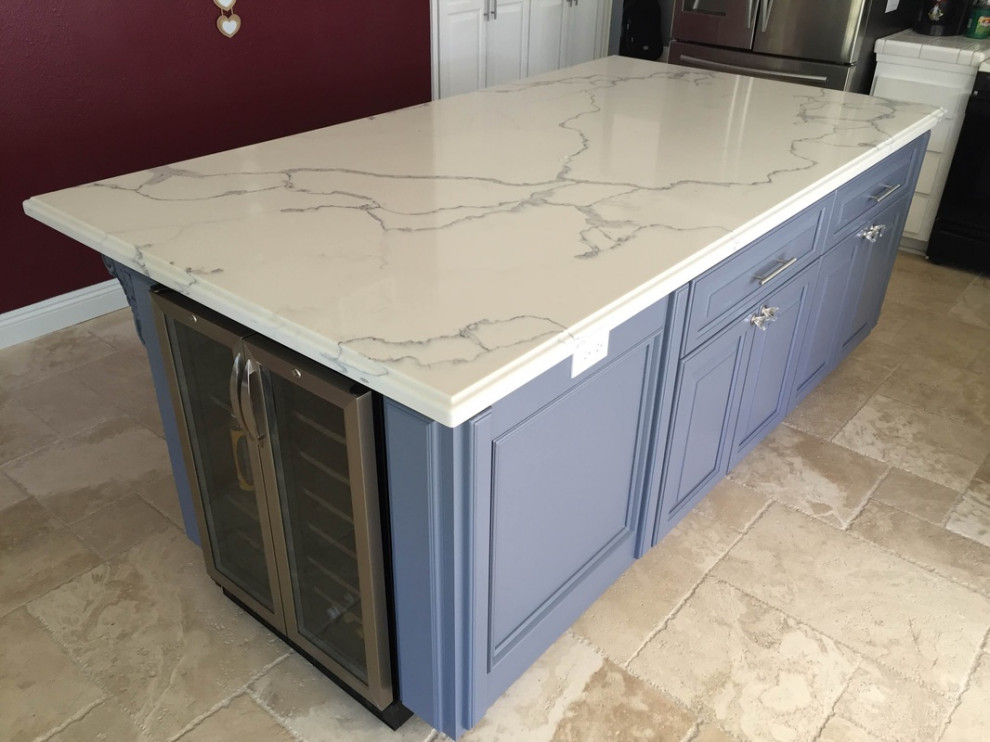 Kitchen blue cabinets island with Calacatta Gold Quartz countertops ...