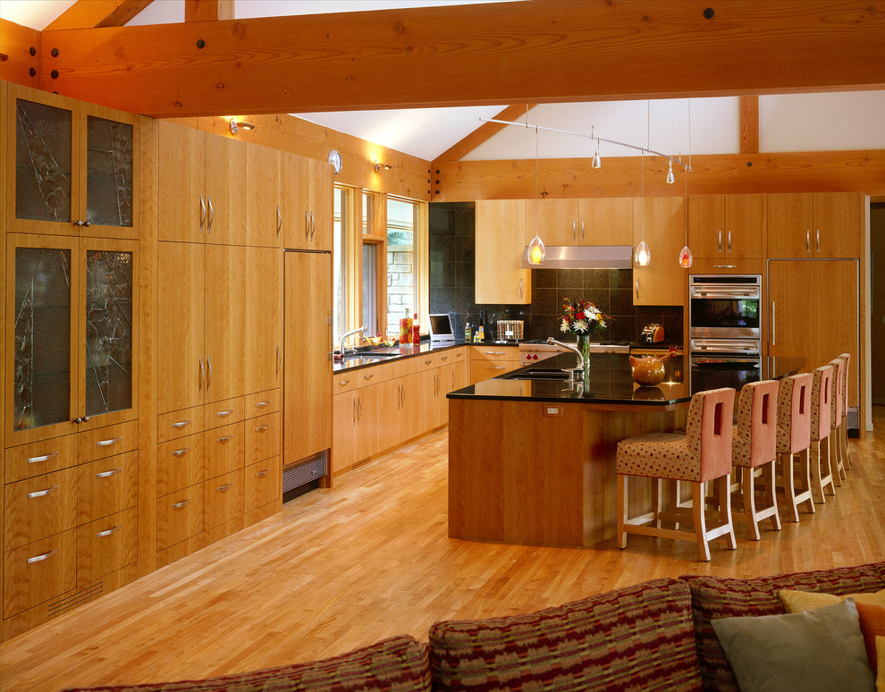 Kitchen of slab wood cabinets with large center island - Contemporary ...