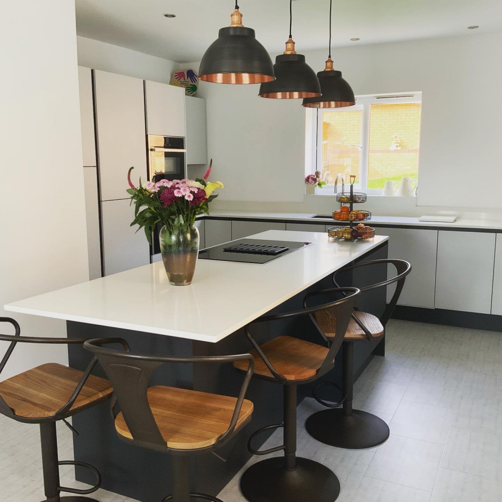 Light grey and anthracite kitchen with copper and wood accents ...