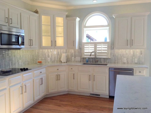 Linear Carrara on a vertical lay complimenting a Quartz counter top ...