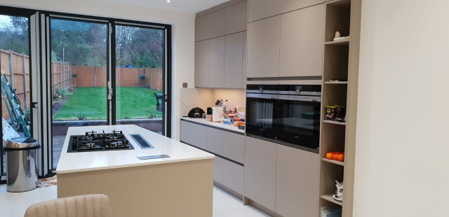 Matt Stone Grey Handleless kitchen in an open plan design in north London N12 Contemporary Kitchen London by Finchley Kitchens Houzz