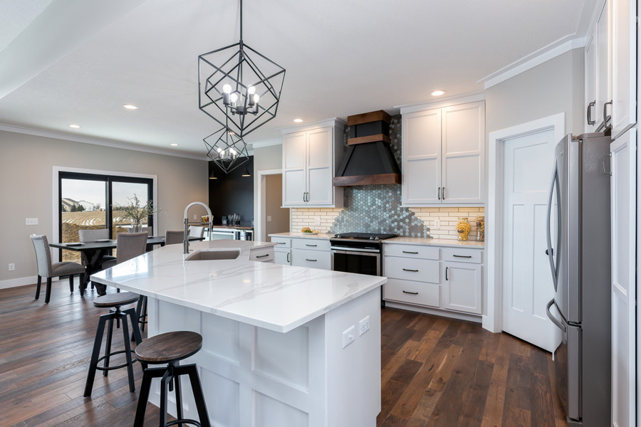 McCoy Homes Quad Cities Kitchen With White Cabinets and Matte Black ...