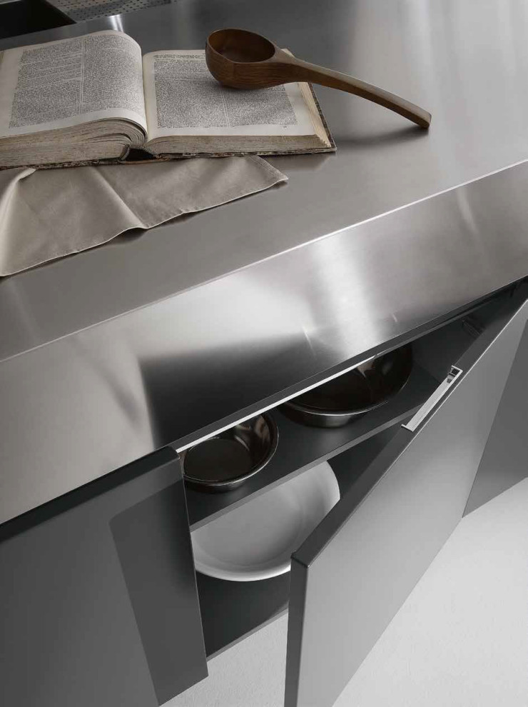 Modern black and wood kitchen with hidden appliances and stainelss ...