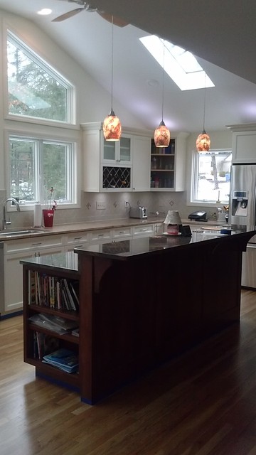 Modern kitchen with beautiful stretches of granite and center island ...