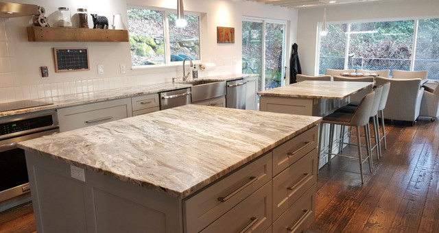 Modernize old two story home, expand over existing garage ...