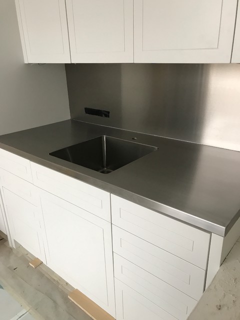 Nice little laundry room stainless counter with a welded in sink and ...