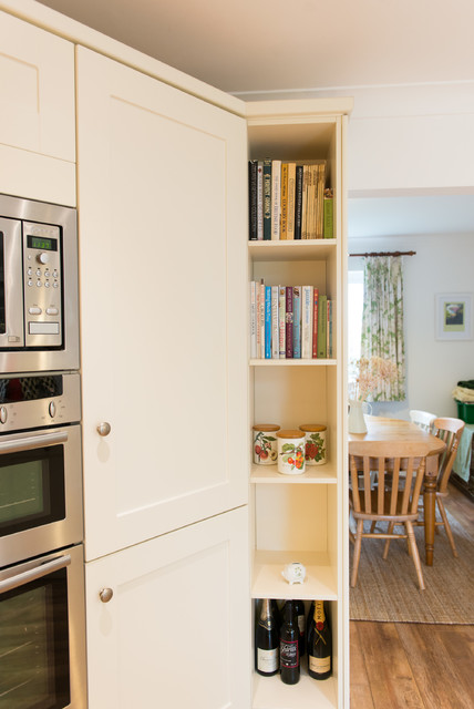 Open shelving adds a splash of colour with cookery books and storage ...