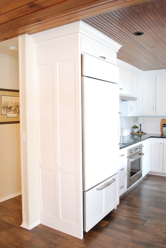 Paneled refrigerator door and drawer with lift-up door above ...