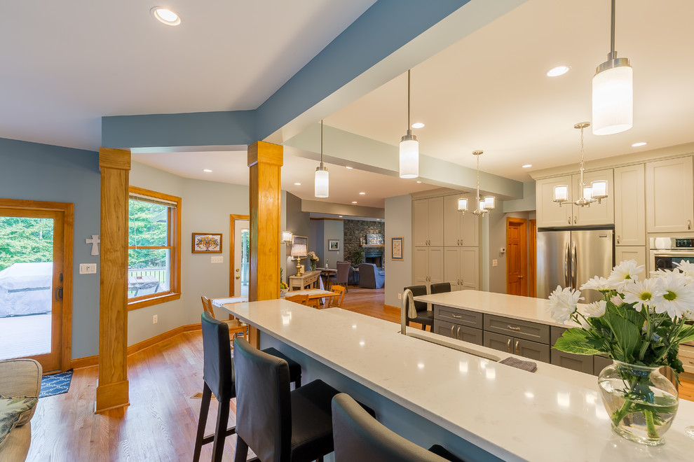 Pendant lighting over the countertop bar area. - Transitional - Kitchen ...