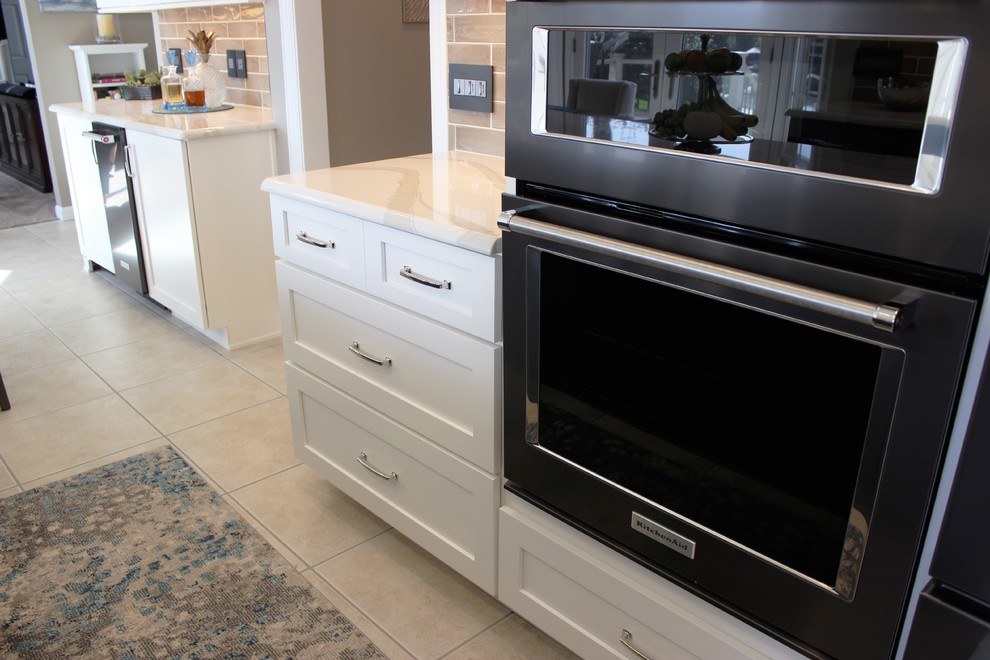Quad Cities Kitchen With Gray Base Cabinets and Waterfall Counters ...