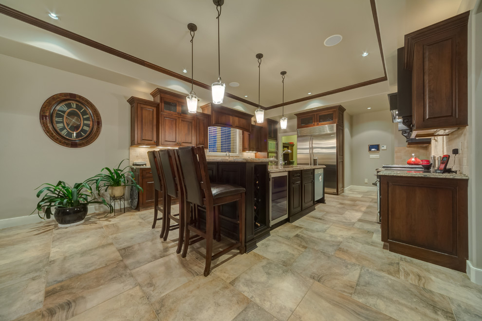 Raised ledge on spacious island - Traditional - Kitchen - Calgary - by ...