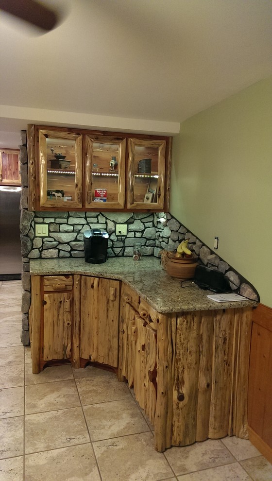 Rustic Red Cedar Kitchen with cultured Stone Backsplash - Rustic ...