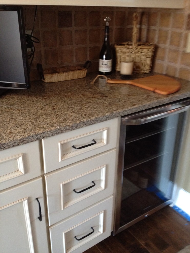Schuler cabinets in White Chocolate Main/Heirloom Black Island in ...