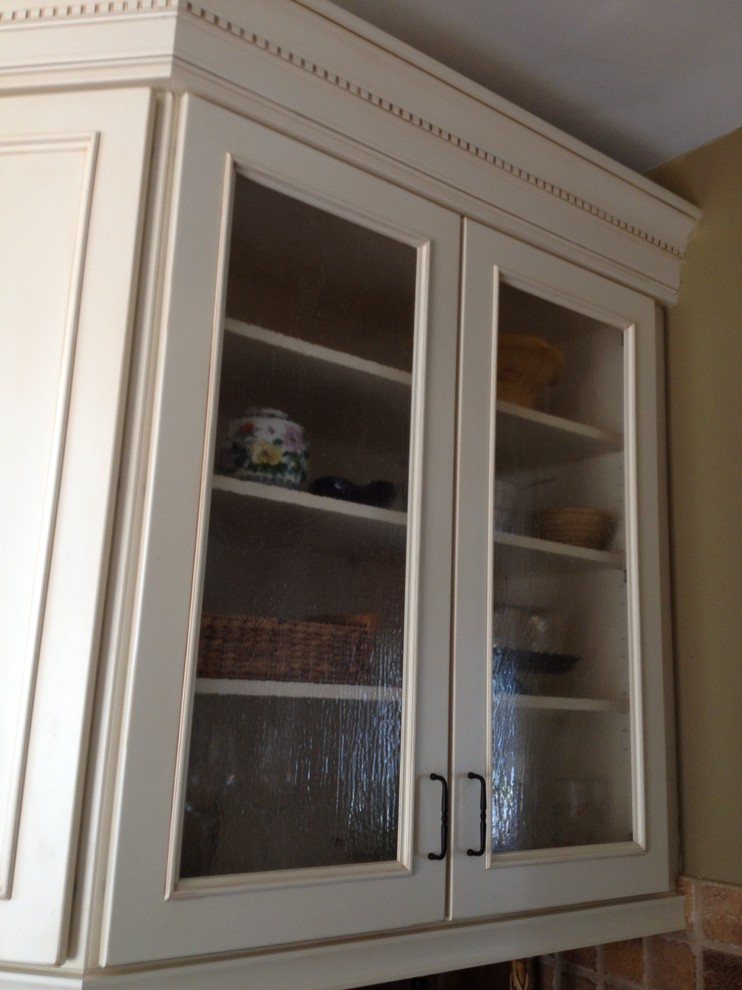 Schuler cabinets in White Chocolate Main/Heirloom Black Island in ...