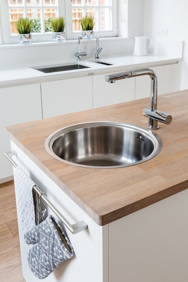 Sleek Scandinavian kitchen in white with separate pantry - Contemporary ...