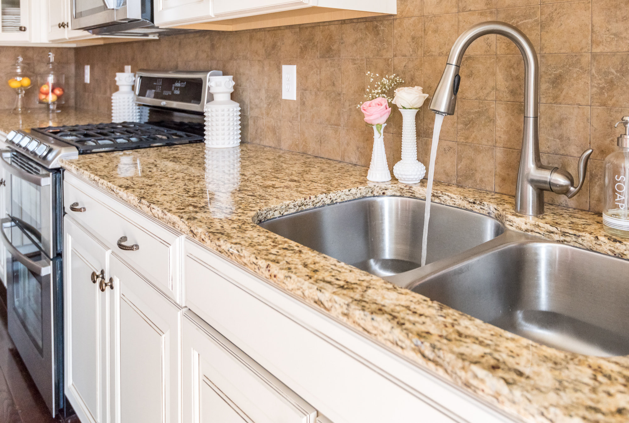 Santa Cecilia Granite With White Cabinets