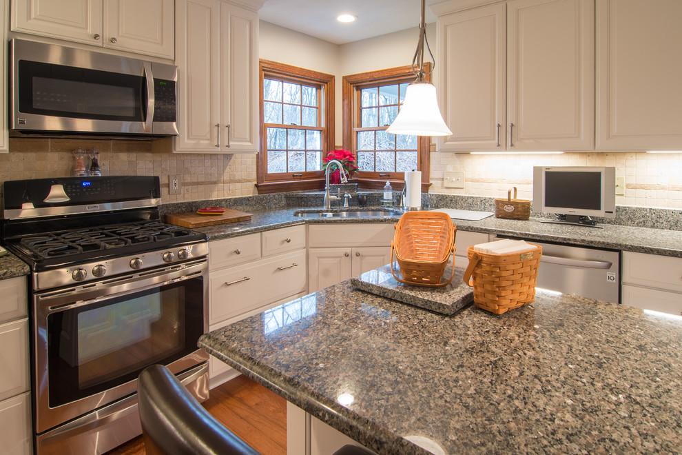 Timeless traditional kitchen with corner sink and granite countertops ...