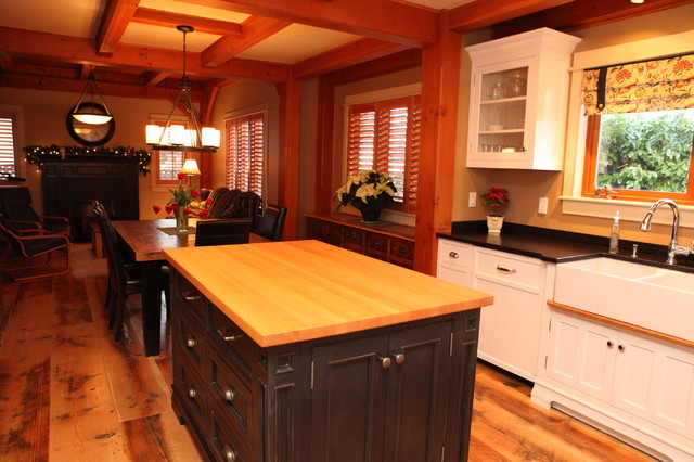 Traditional black kitchen island in Wesley Ellen timber-frame showroom ...