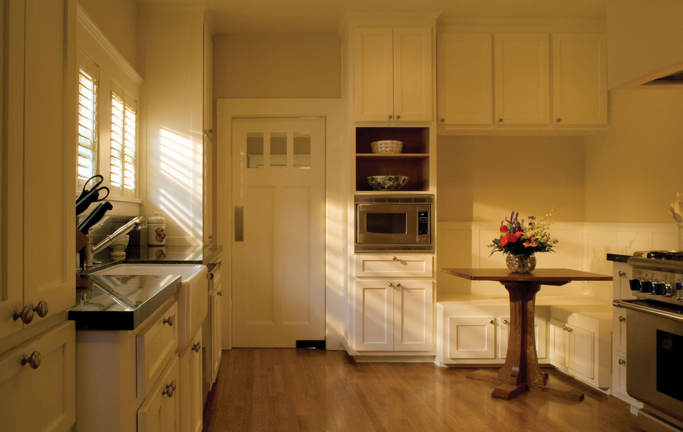 Traditional, painted kitchen with inset doors and built in bench ...