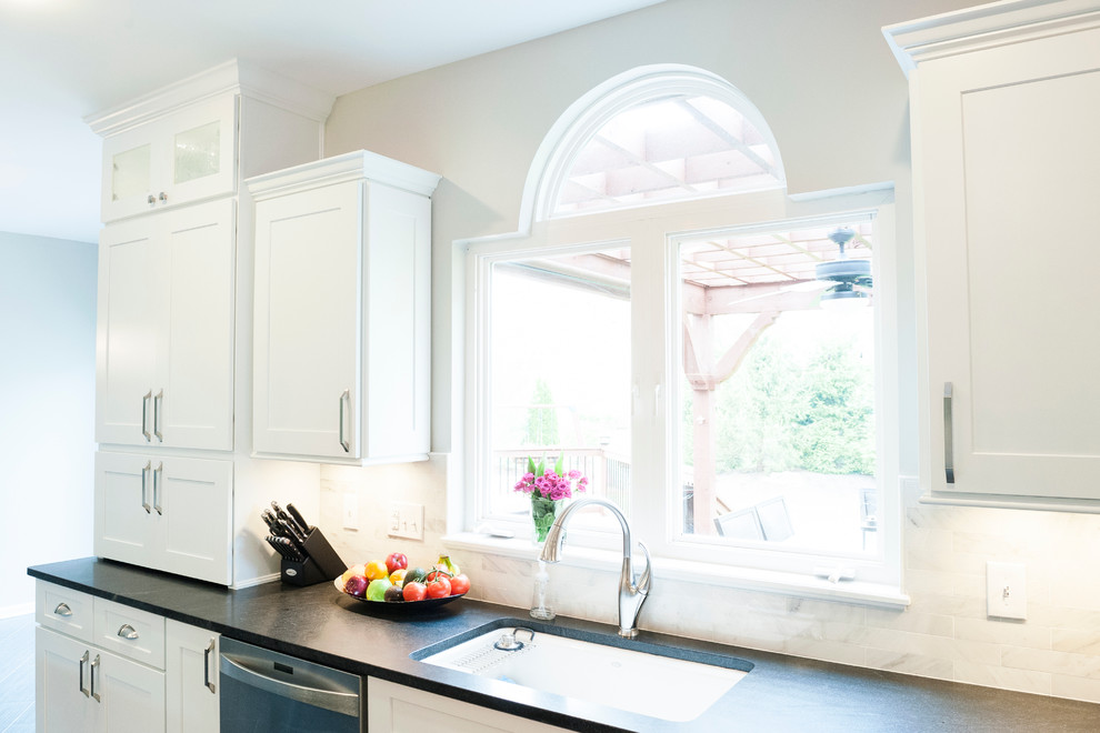 Transitional kitchen with custom window with white shaker cabinets ...