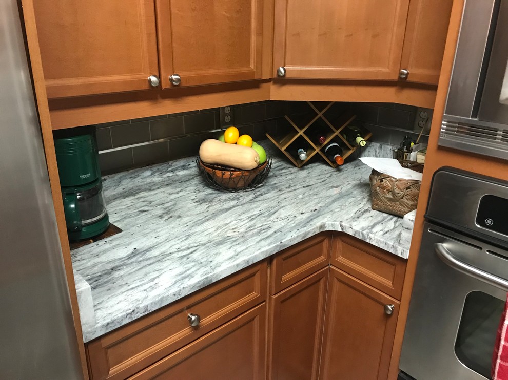 Welcoming, traditional design kitchen in "Thunder White" granite ...