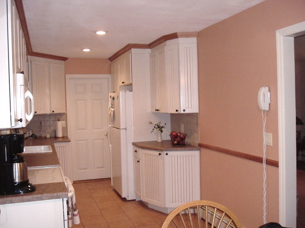 White Cabinets with a Touch of Nutmeg Moldings - Traditional - Kitchen ...
