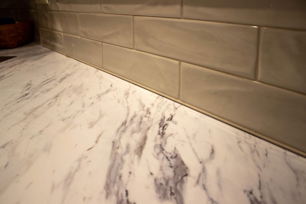 White Kitchen with Calcutta Marble Laminate Countertop and Tile ...