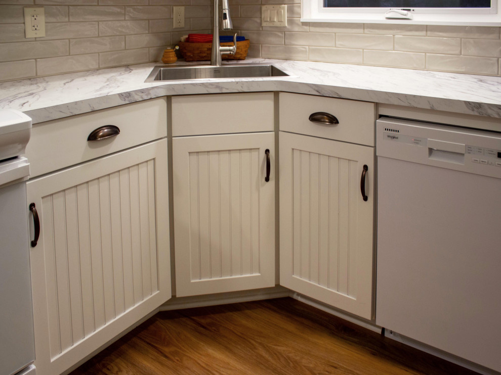 White Kitchen with Calcutta Marble Laminate Countertop and Tile ...