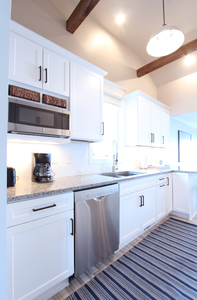 White Kitchen with Reclaimed Beams and Vaulted Ceiling - Farmhouse ...