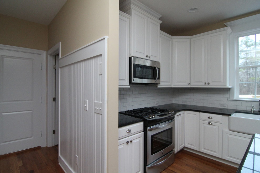 White kitchen with wainscot detailing - Country - Kitchen - Raleigh ...