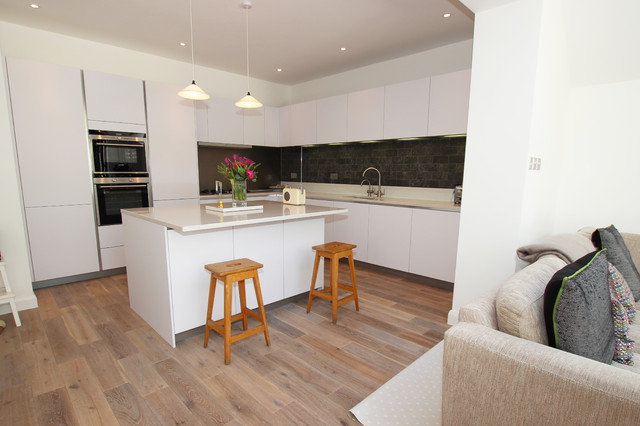 White Open Plan Kitchen with Island - Modern - Kitchen - London - by ...