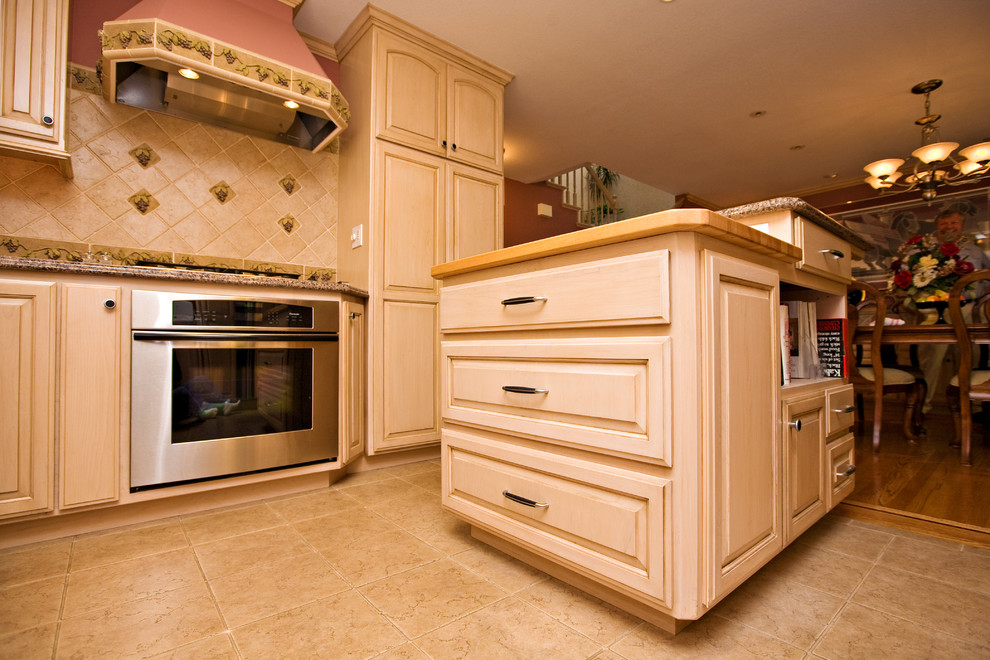 Wine themed kitchen with wine cooler and grape tile details ...