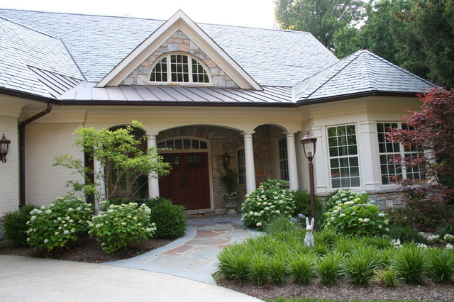 Columned Portico with Flagstone Walkway and Charming Landscape ...