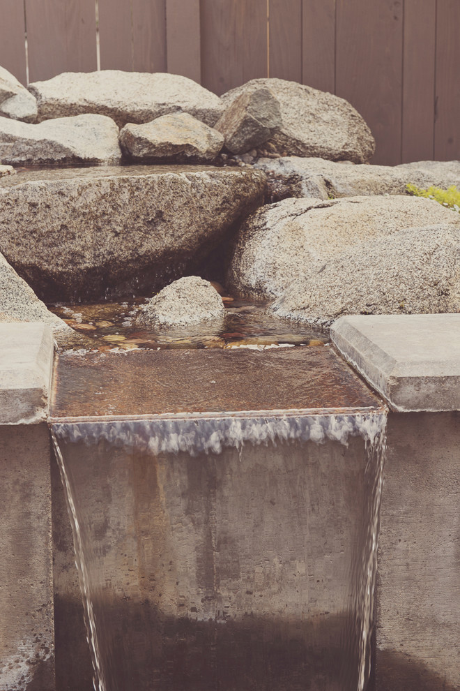 Concrete water feature with granite boulders - Modern - Landscape ...