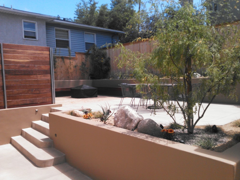 Contemporary Landscape with custom concrete work and stucco retaining ...