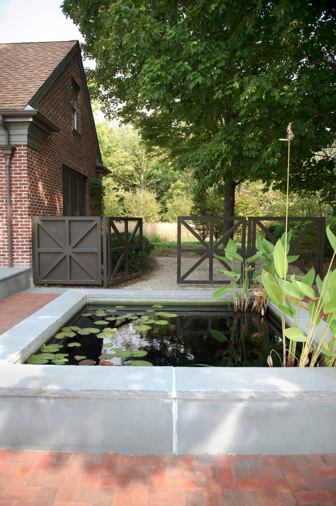 Custom steel gates with raised bluestone reflecting pool - Traditional ...