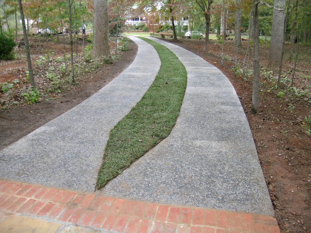 Exposed Aggregate concrete strips, stained gray and washed ...