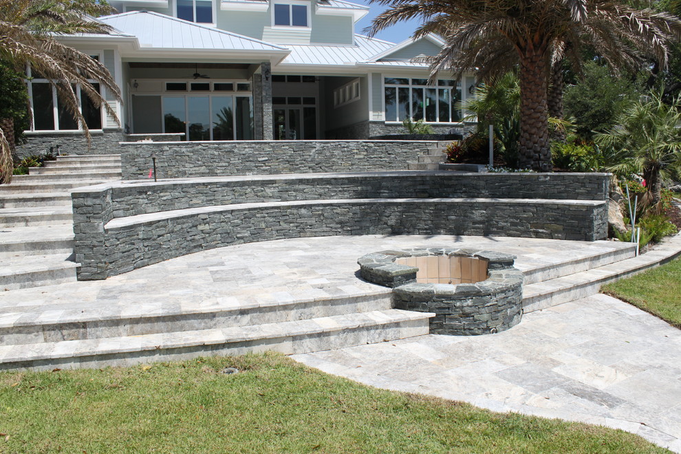 Florida Home with Stone Cladding, Sitting Walls, Outdoor Kitchen, and ...