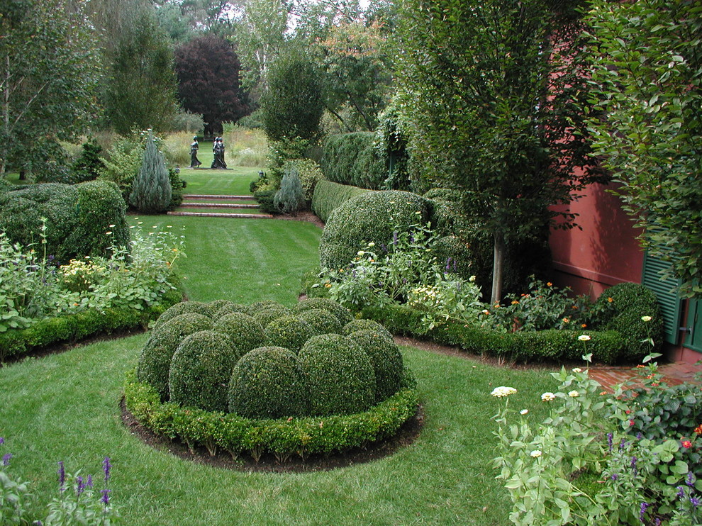 Formal plantings dotted with fragrant and colorful perennials and ...